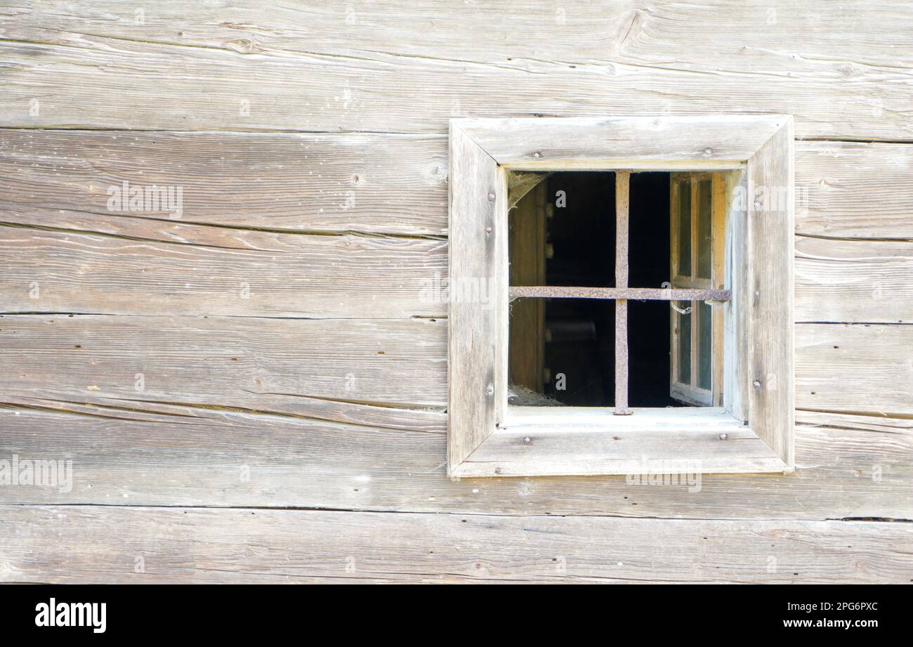 Aged wooden window with glazing and partially weathered in rustic homes ...