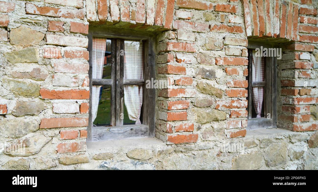 Aged wooden window with glazing and partially weathered in rustic homes ...
