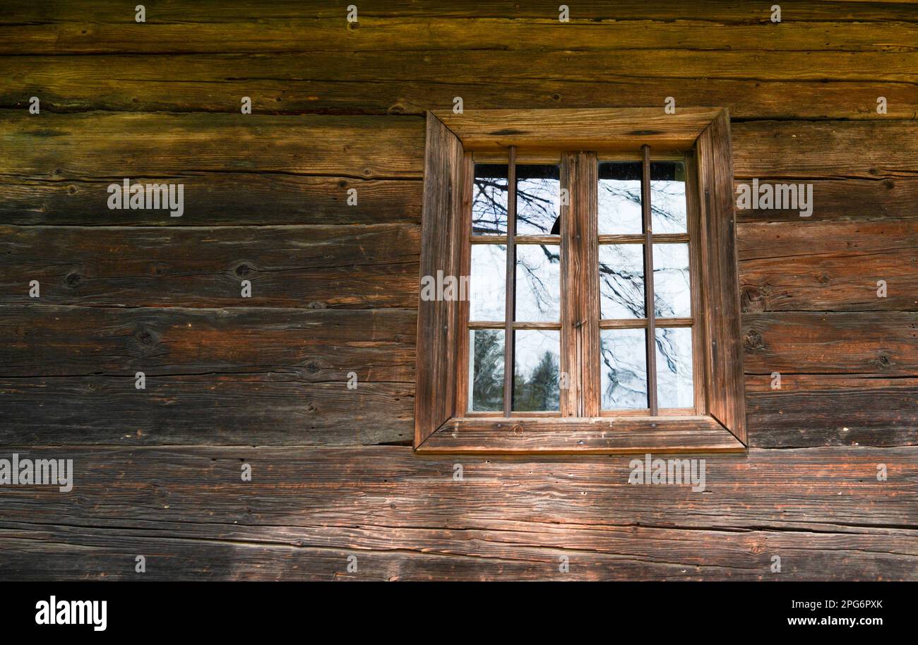 Aged wooden window with glazing and partially weathered in rustic homes ...