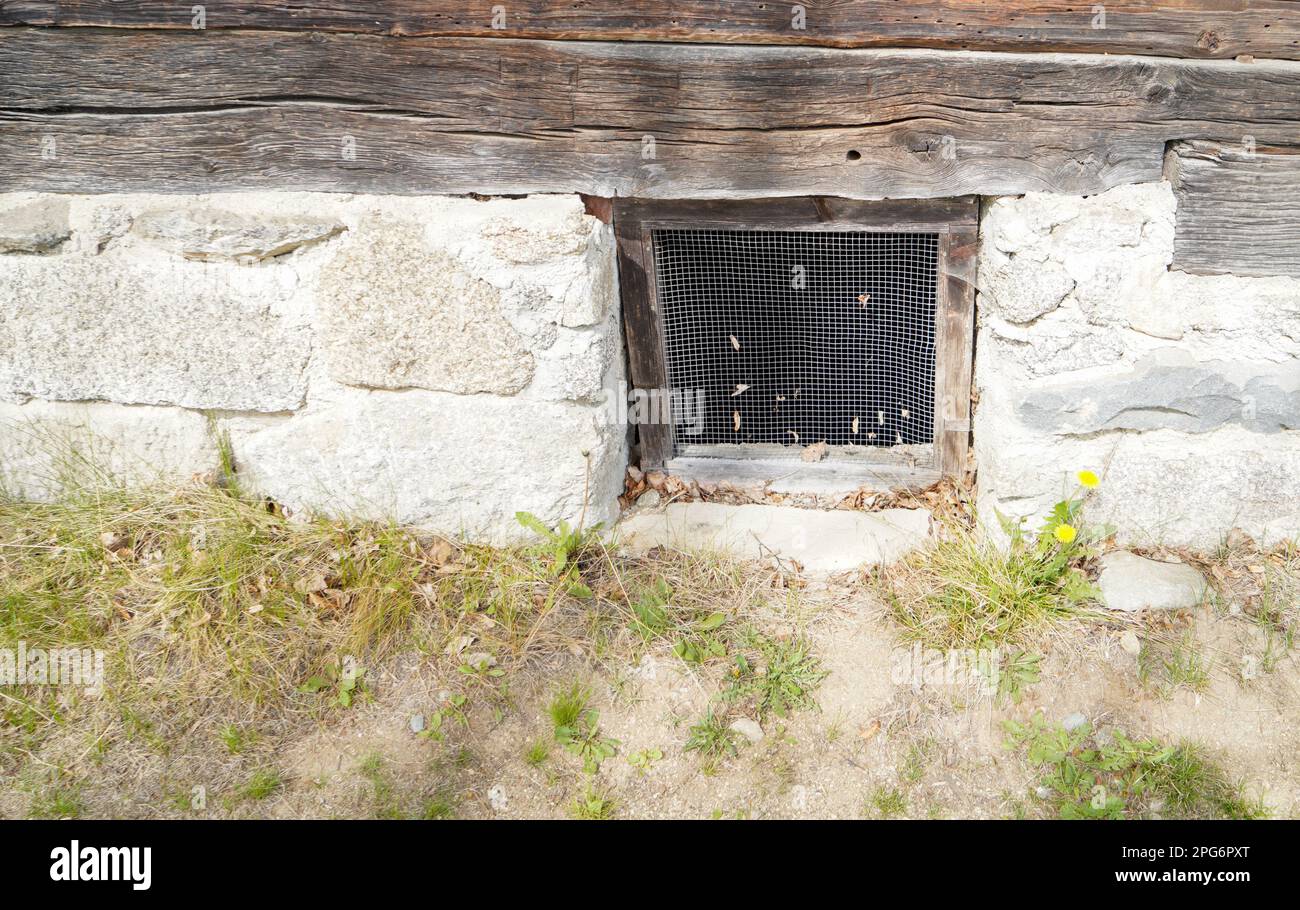 Aged wooden window with glazing and partially weathered in rustic homes ...