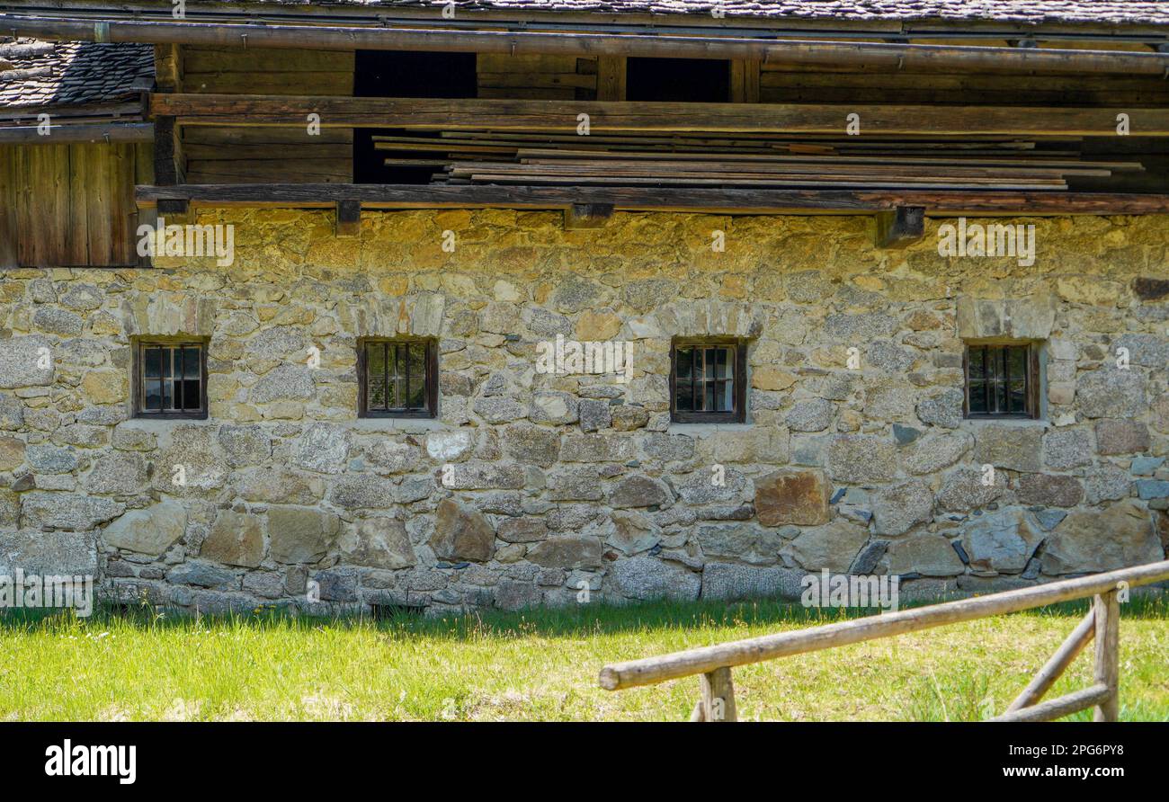 Aged wooden window with glazing and partially weathered in rustic homes ...
