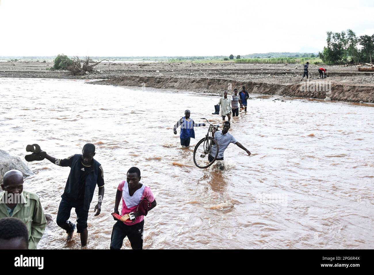 FILE - People wade through floodwaters in the aftermath of Tropical ...