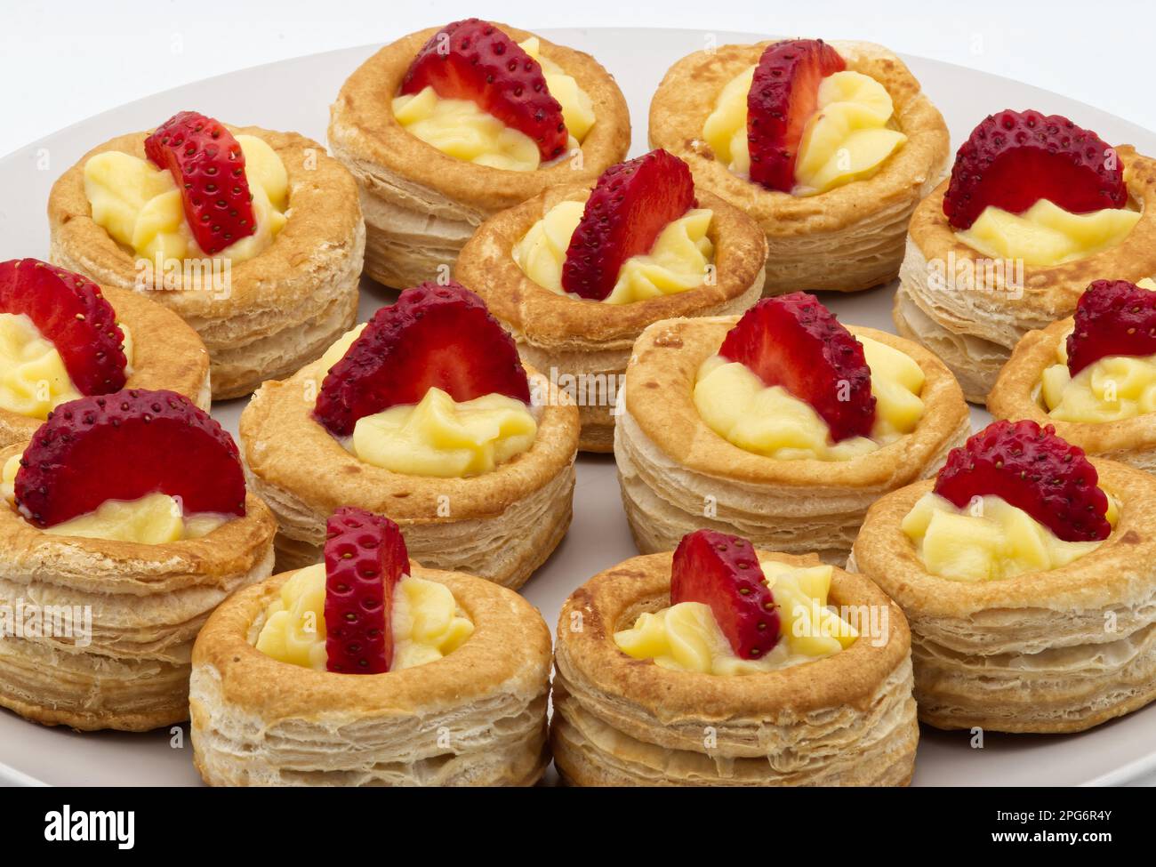 Sweet homemade Vol au vent filled with cream and strawberry Stock Photo ...