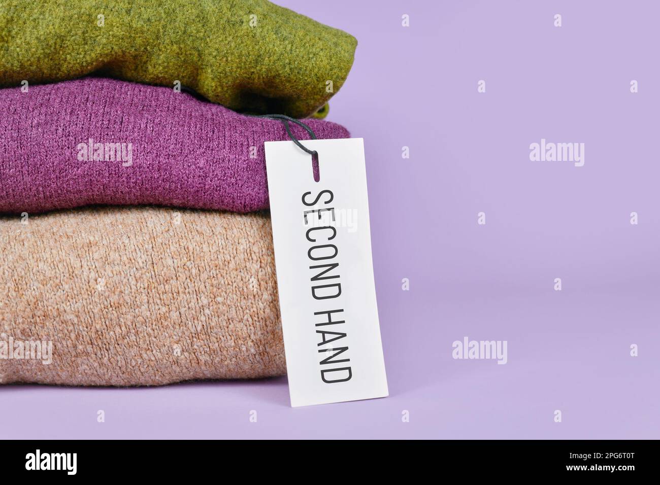 Pile of second hand clothing with copy space Stock Photo - Alamy