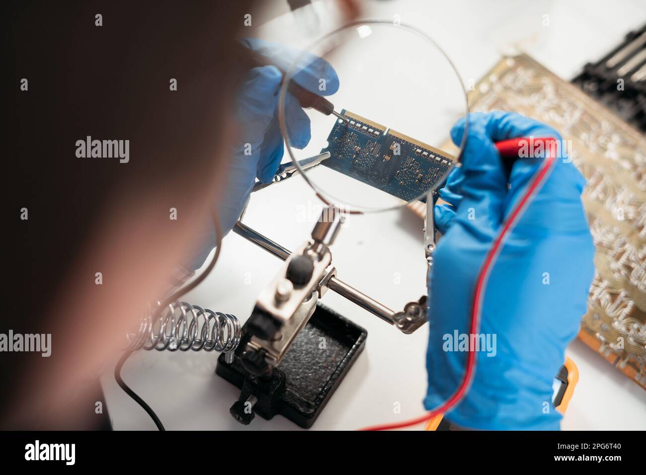 Service engineer testing new RAM memory chip to the laptop with digital ...