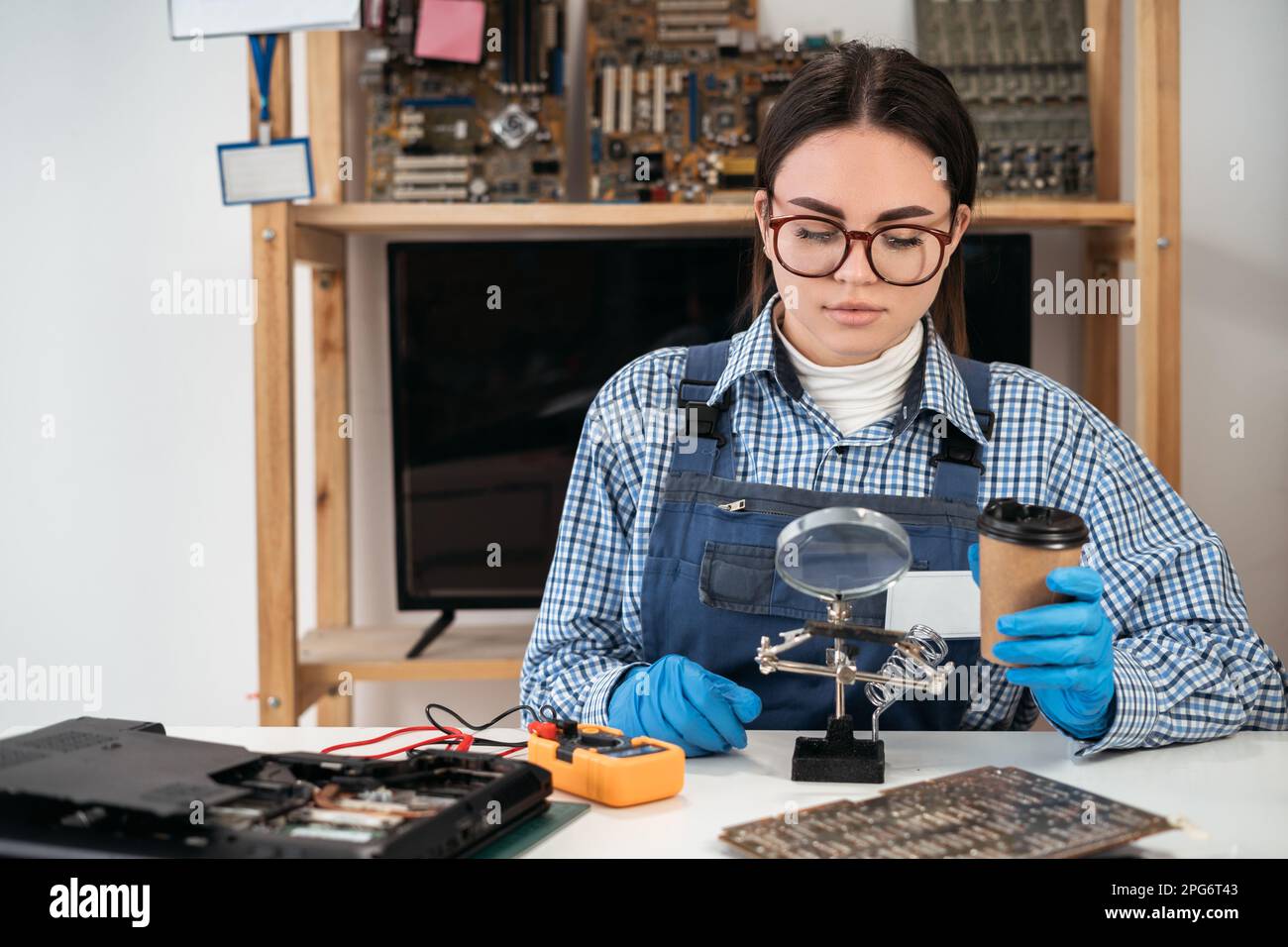 Technician repairing computer hardware. Small business owner of a ...