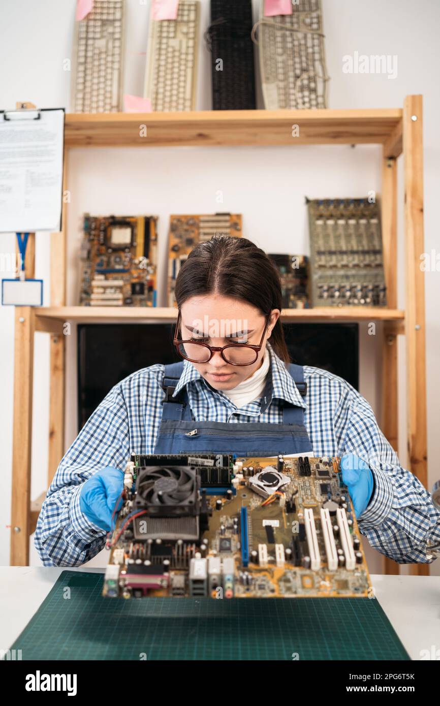 Small business. Computer female technician or engineer working with ...