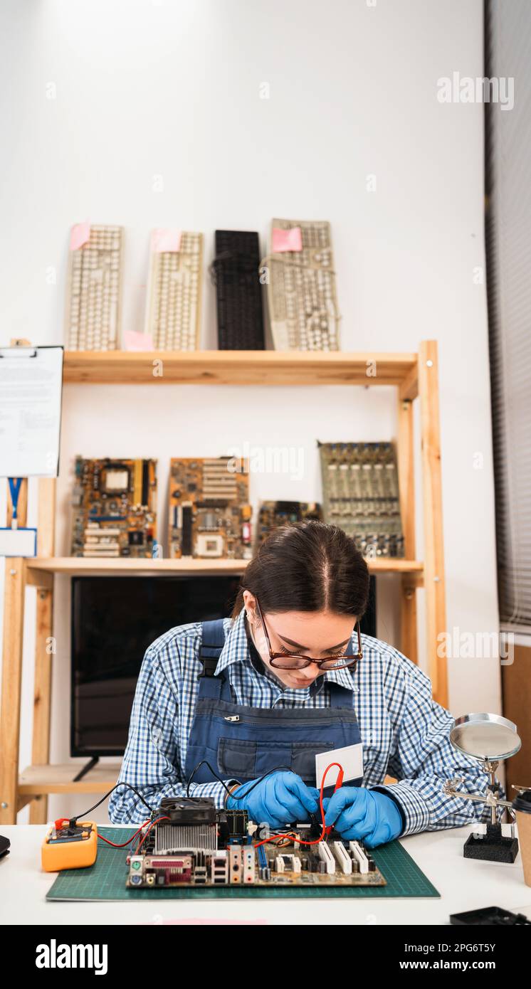 Computer master checks the electronic motherboard and performs ...