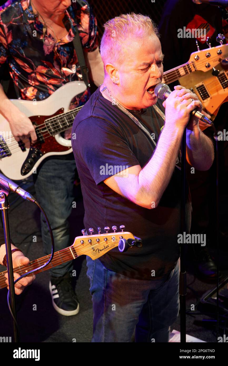 Punk producer and singer Mike Bennett performing with The Blockheads at ...