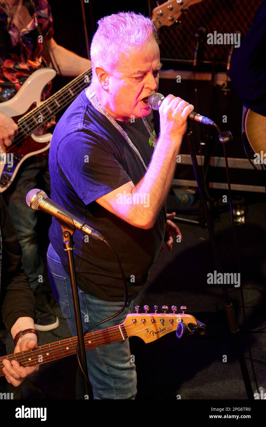 Punk producer and singer Mike Bennett performing with The Blockheads at ...
