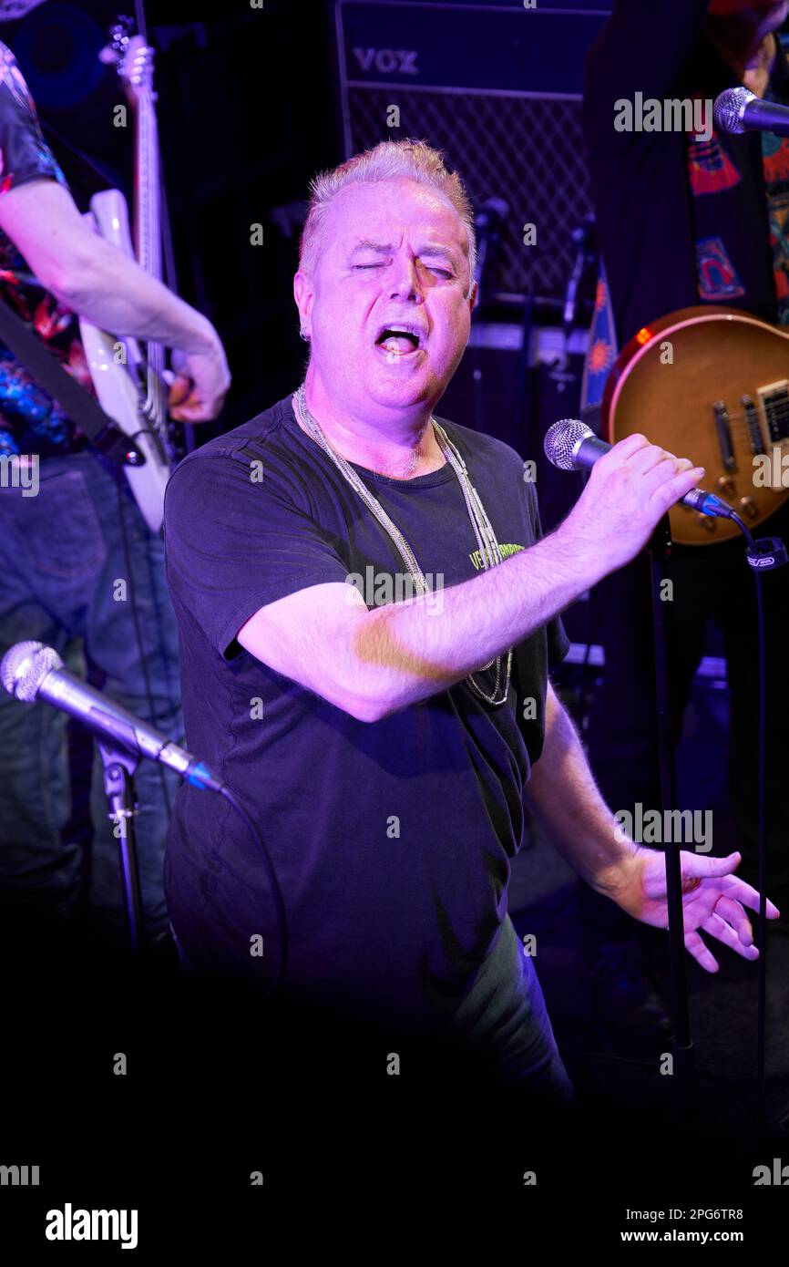 Punk producer and singer Mike Bennett performing with The Blockheads at ...