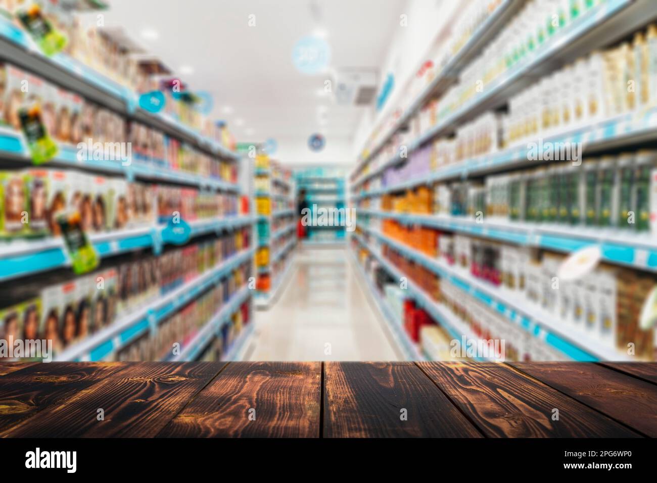 Grocery table background. Blurred supermarket shelves with goods and ...