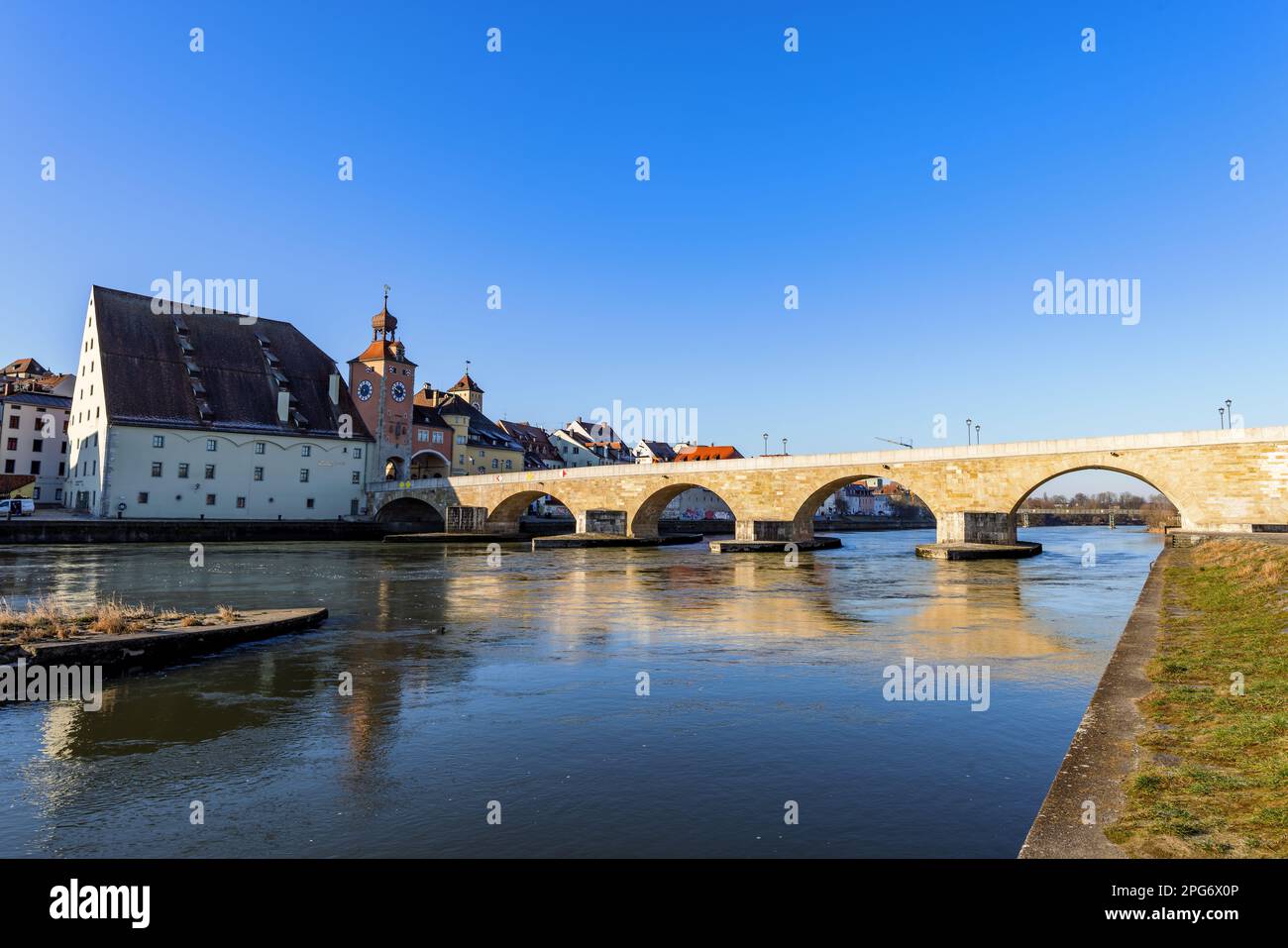 View over the Danube river towards the stone bridge in Regensburg ...