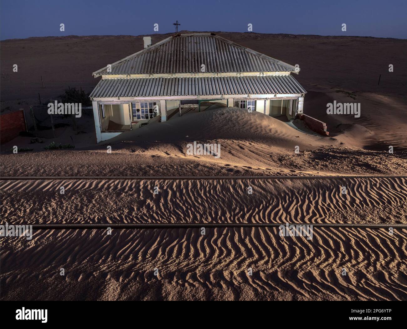 The sands of the Namib Desert slowly advance on a railway house near ...