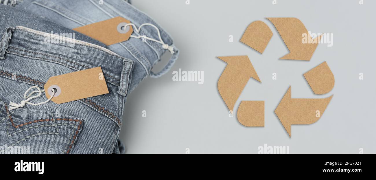 Long banner with Stack of gray jeans and empty tags Stock Photo - Alamy