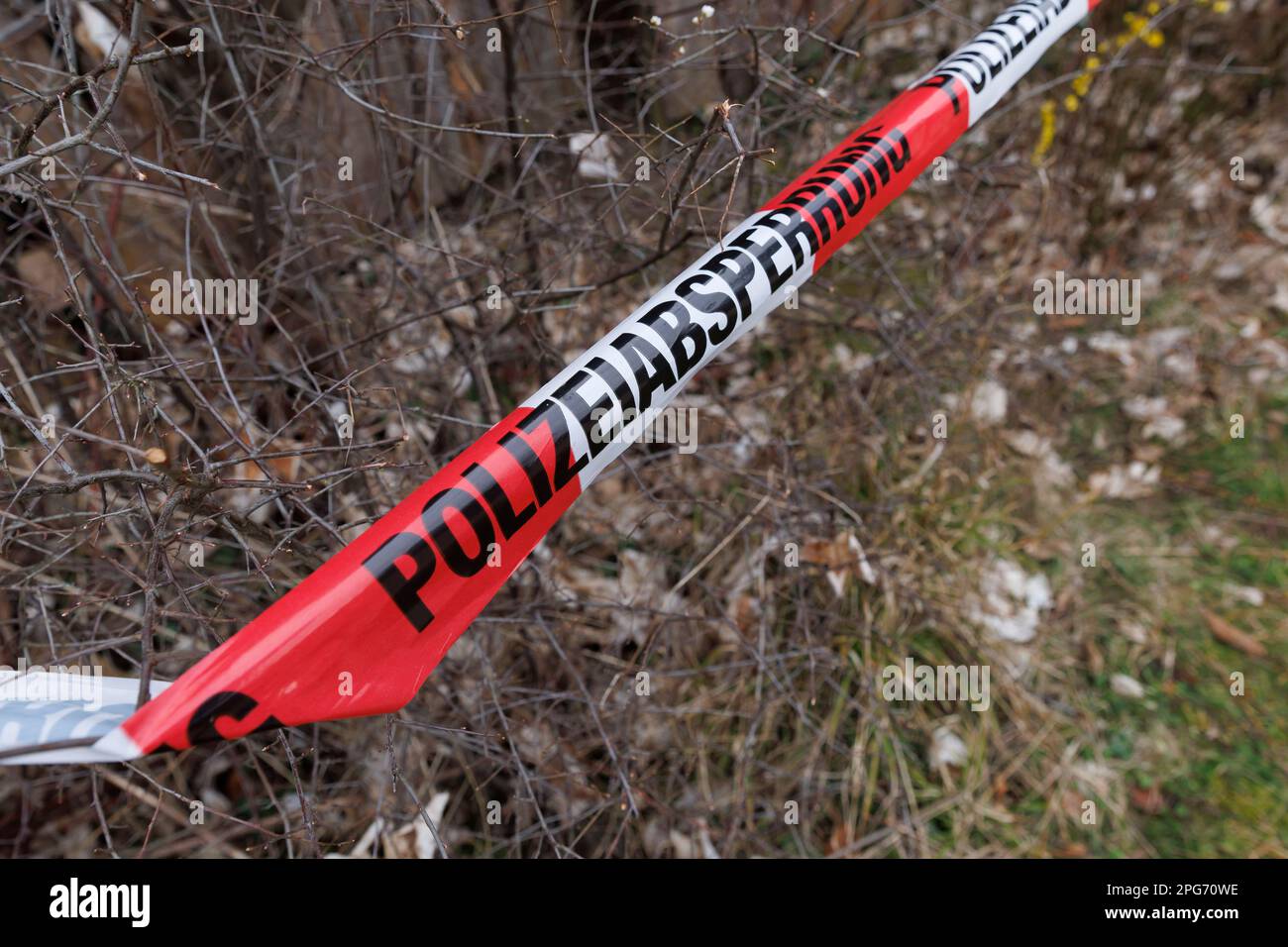 Hattenhofen, Germany. 21st Mar, 2023. Red and white police flutter tape ...