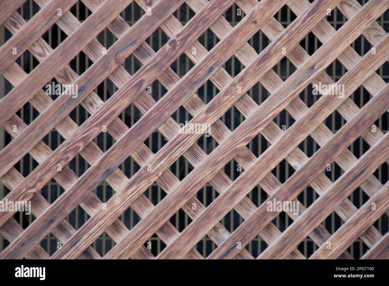 wooden fence with diagonal boards as a background Stock Photo - Alamy