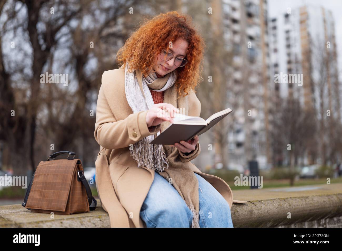 Natural portrait of a caucasian ginger woman with freckles and curly ...