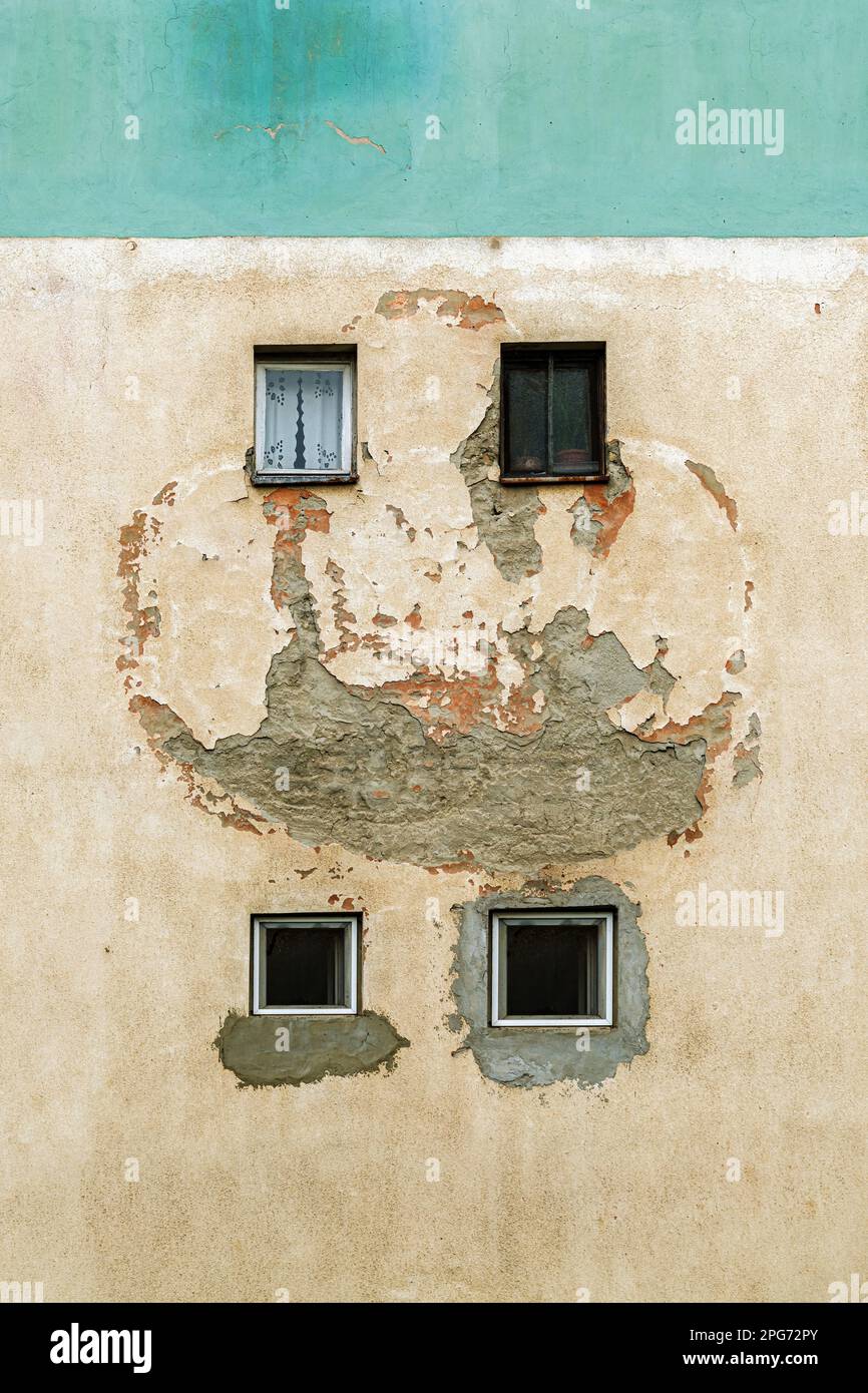 Old worn building facade with small windows, copy space included Stock ...
