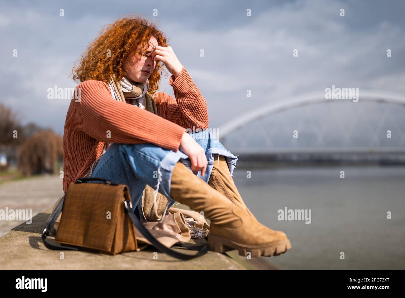 Natural portrait of a caucasian ginger woman with freckles and curly ...