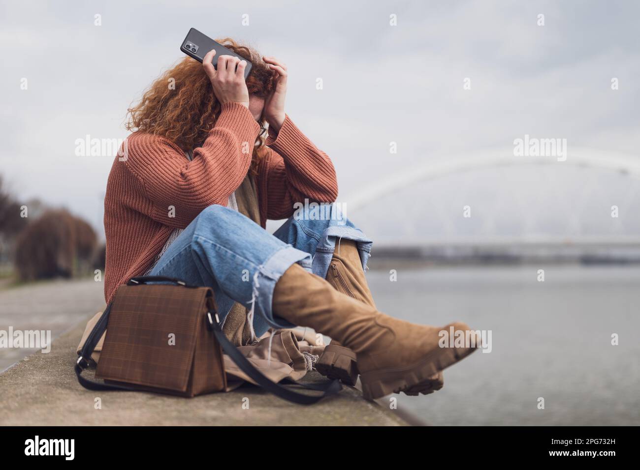 Natural portrait of a caucasian ginger woman with freckles and curly ...