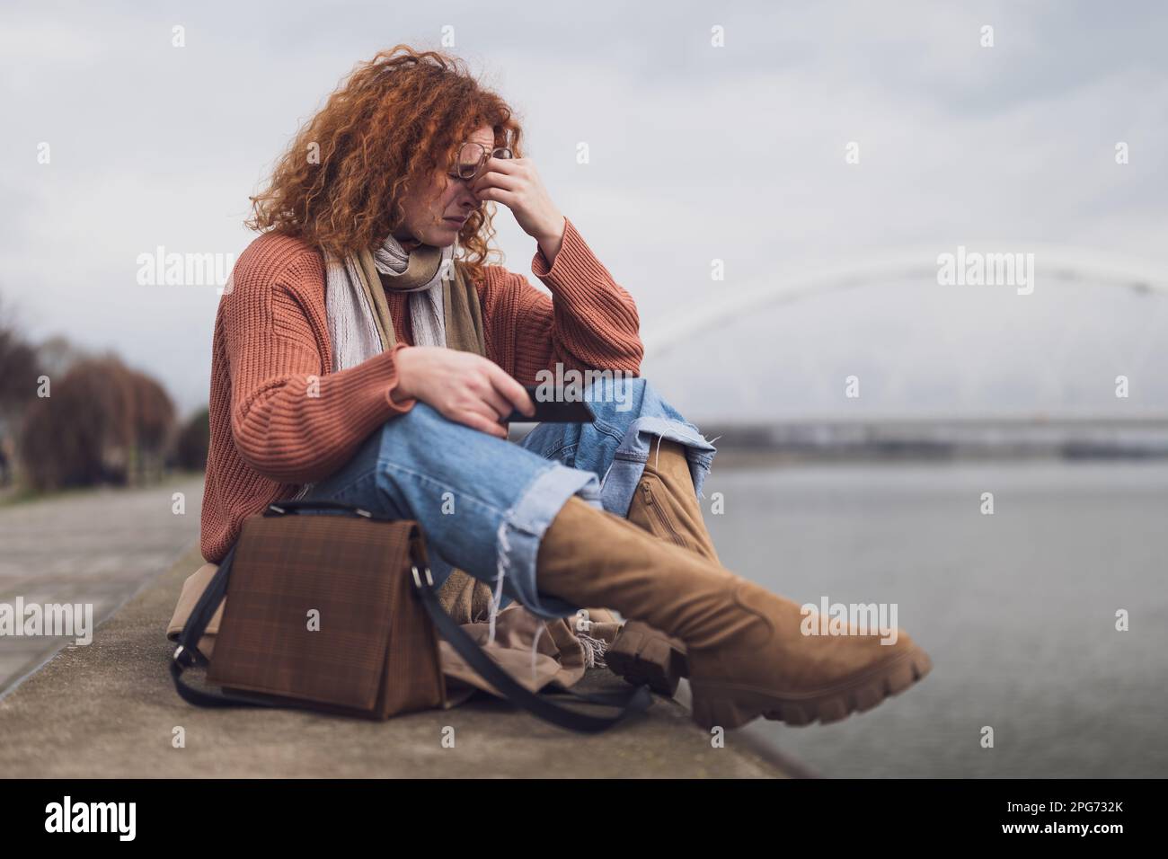 Natural portrait of a caucasian ginger woman with freckles and curly ...