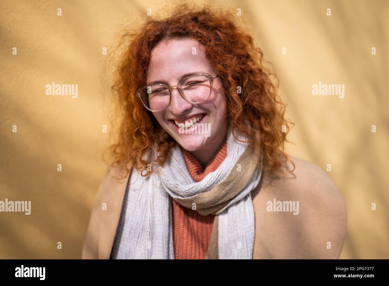 Natural portrait of smiling caucasian ginger woman with freckles and ...
