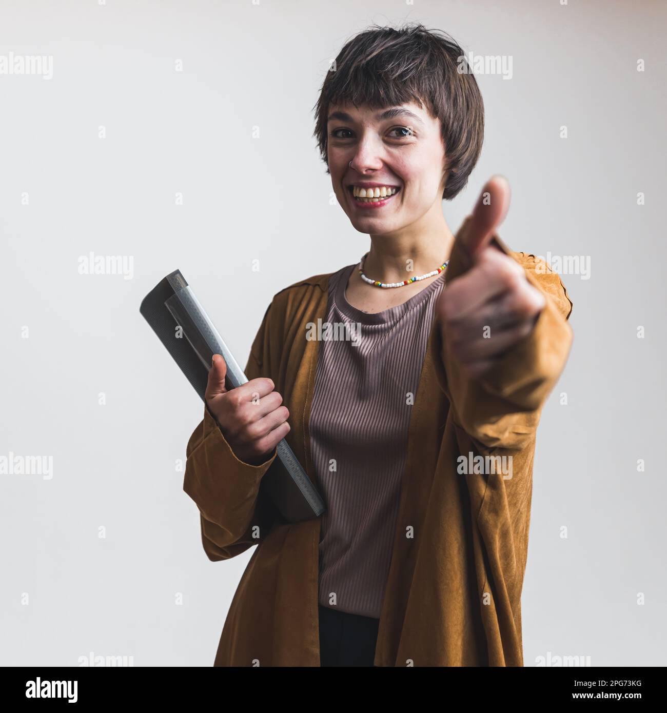 Lady in suit thumbs up hi-res stock photography and images - Alamy