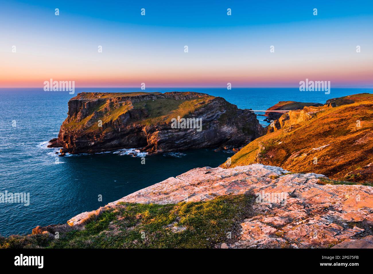 The last red glow of sunlight over Tintagel Island, taken from Glebe ...