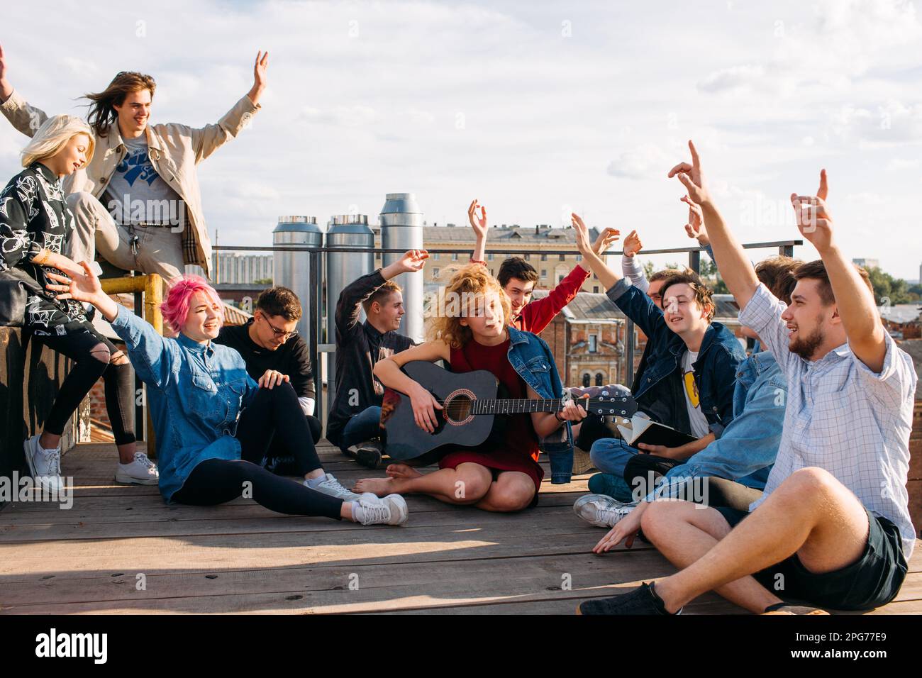 exchange students singing rooftop together bonding Stock Photo - Alamy