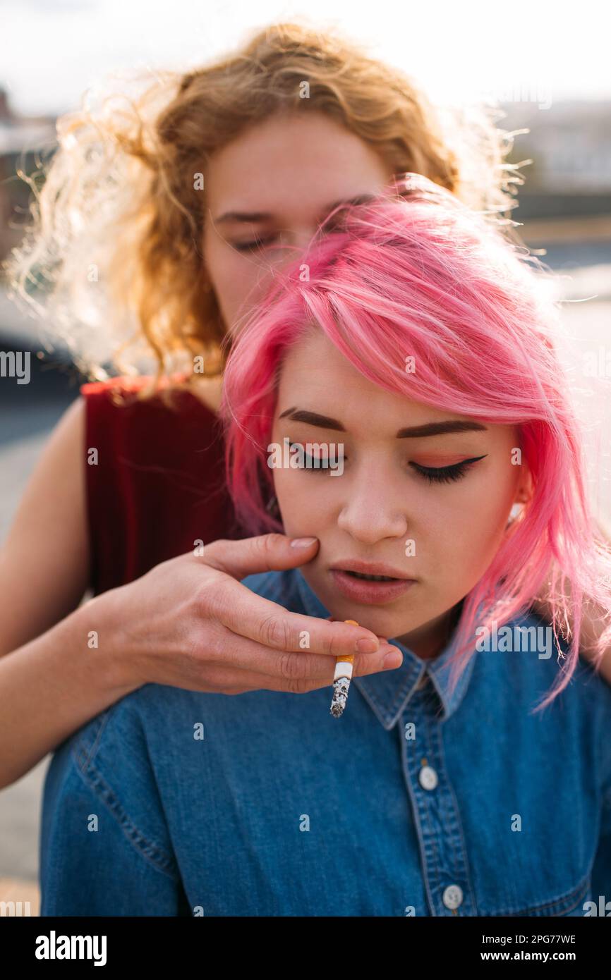 bad influence girl smoking street danger lifestyle Stock Photo - Alamy