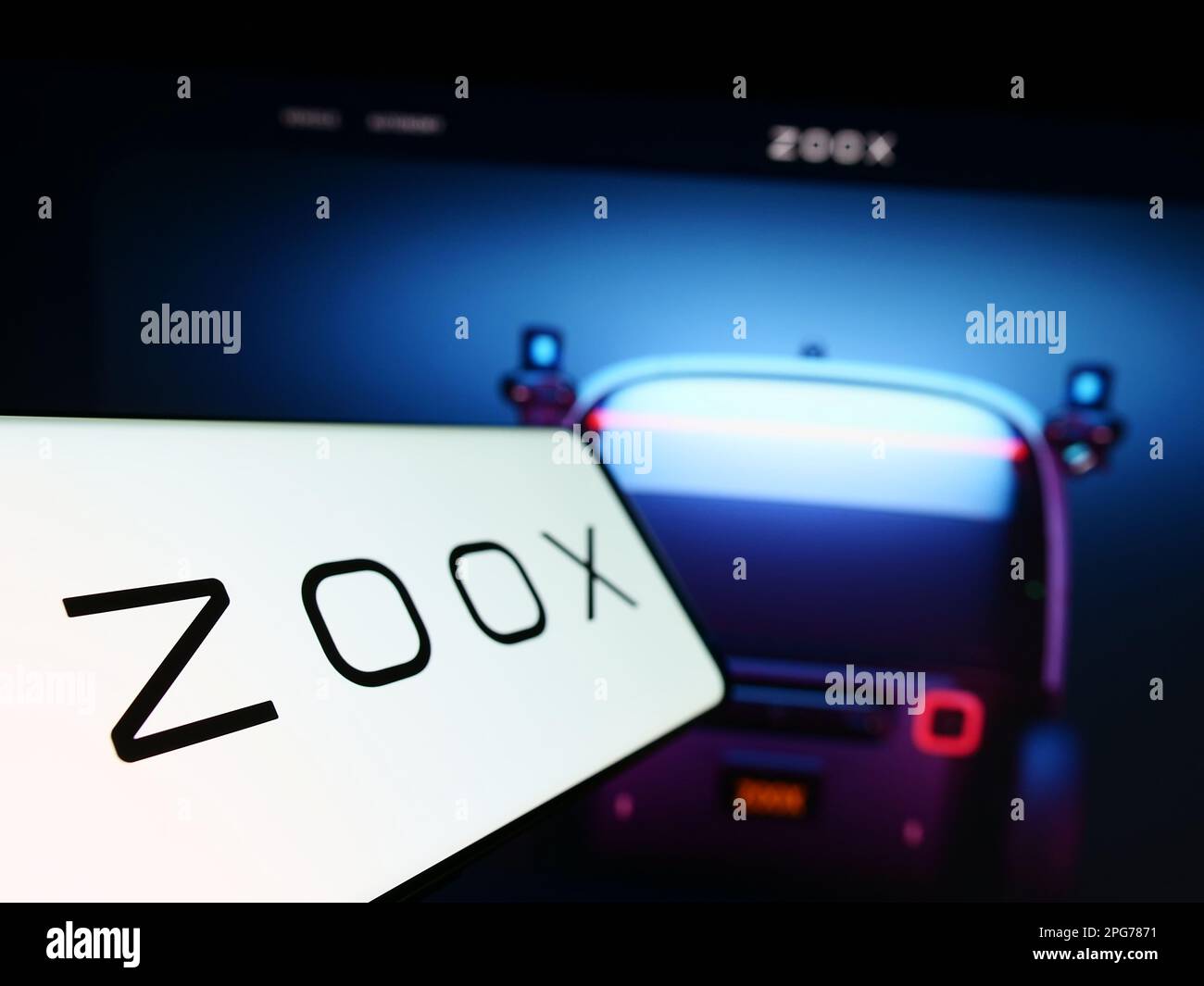 Smartphone with logo of American autonomous vehicle company Zoox Inc ...
