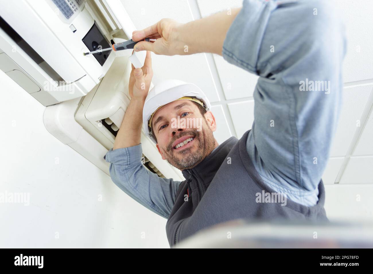 an air conditioning technicianat work Stock Photo - Alamy