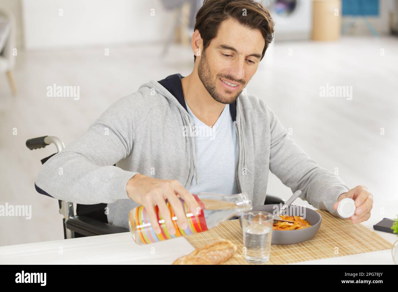 disabled young man having lunch Stock Photo - Alamy