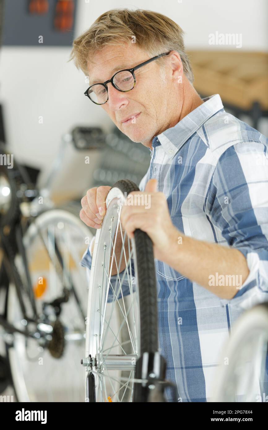 Boy fixing bike hi-res stock photography and images - Alamy