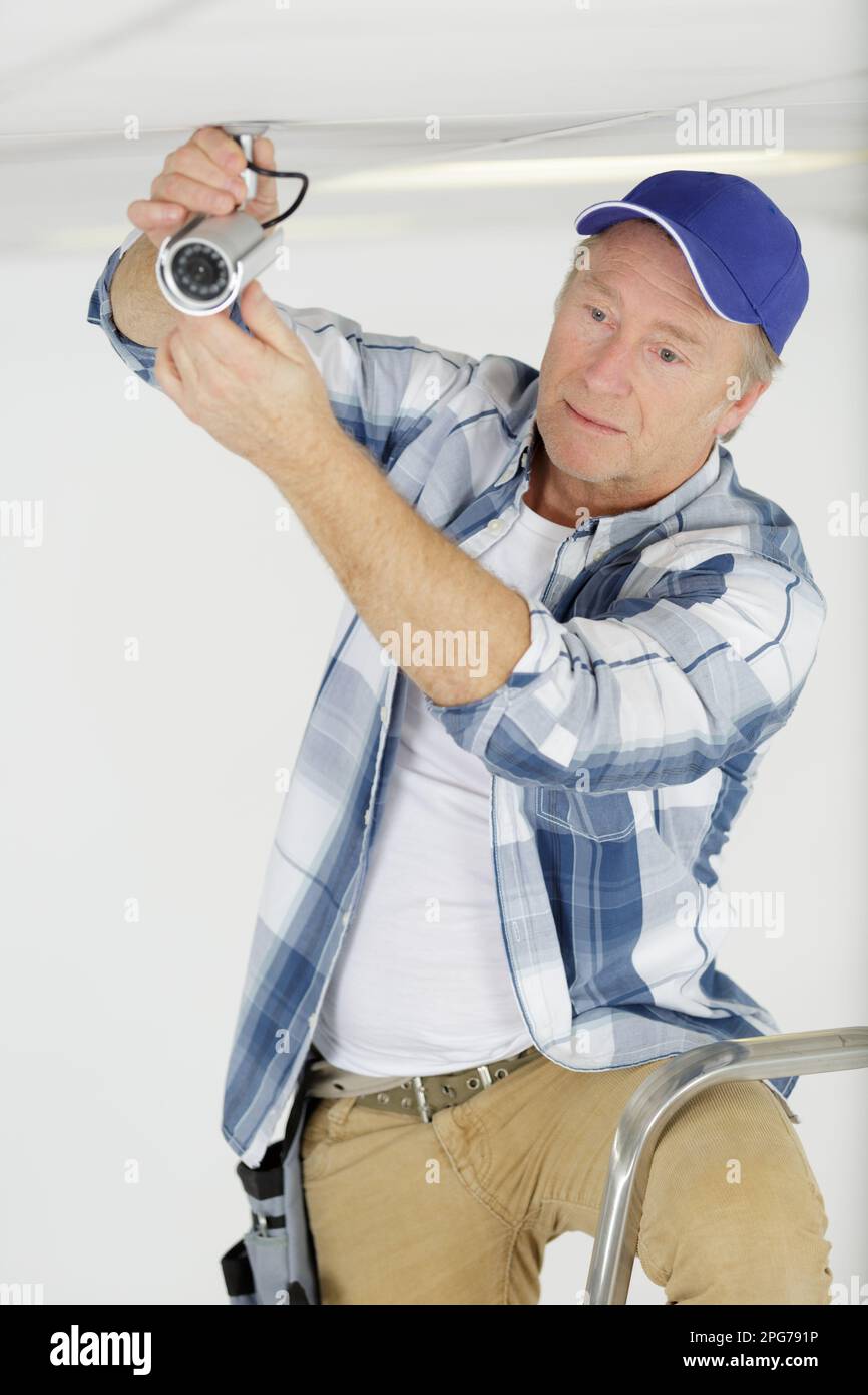 Maintenance of a security camera hi-res stock photography and images ...