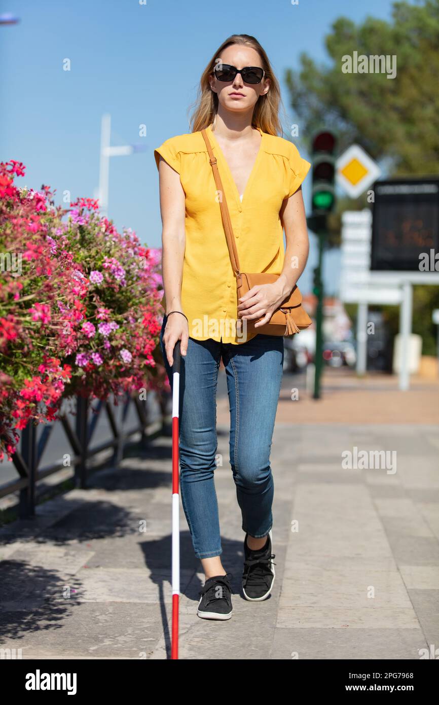 a female blind woman walking Stock Photo - Alamy