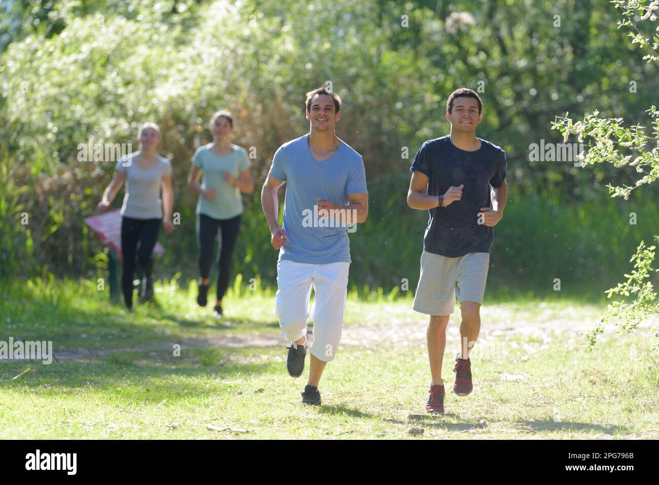 young people are running outdoors Stock Photo - Alamy