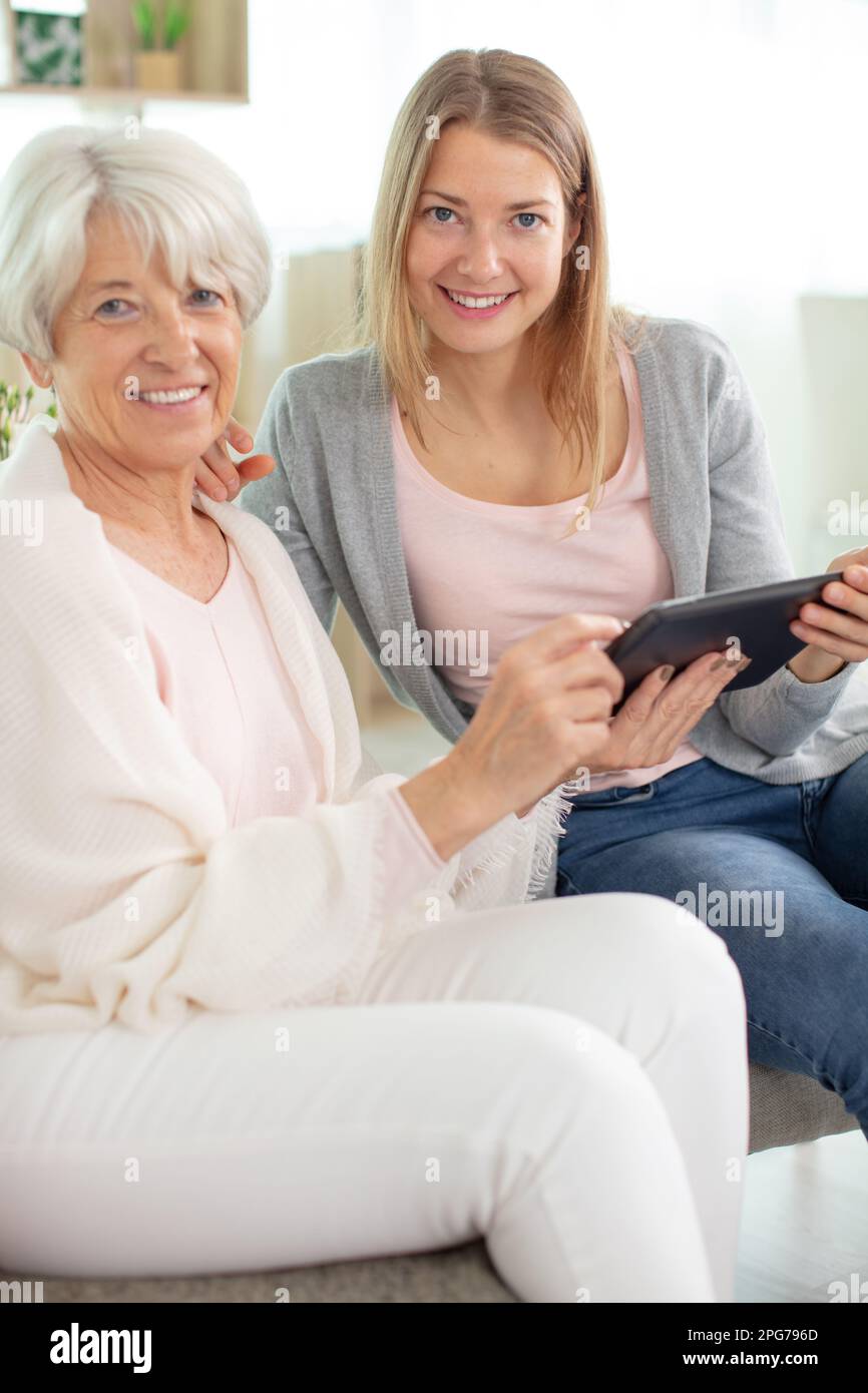 Mom older daughter tablet hi-res stock photography and images - Alamy