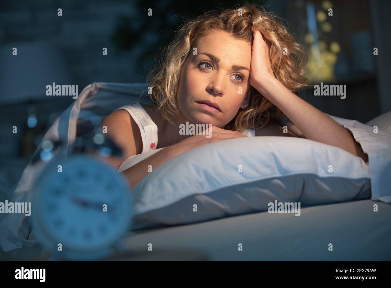 troubled sleepless woman in bed Stock Photo - Alamy