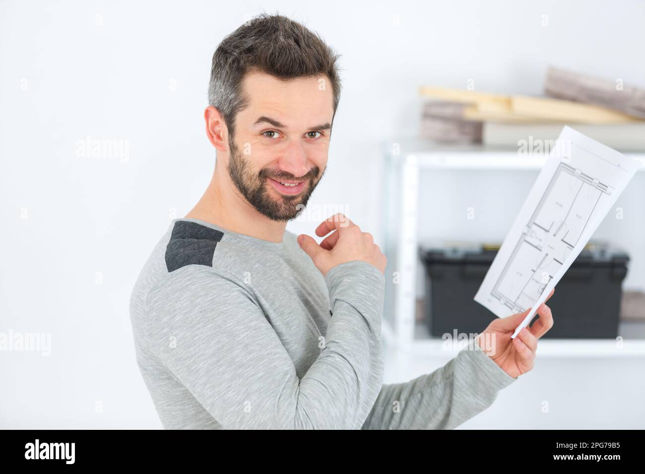 real-estate agent checking house plans Stock Photo - Alamy