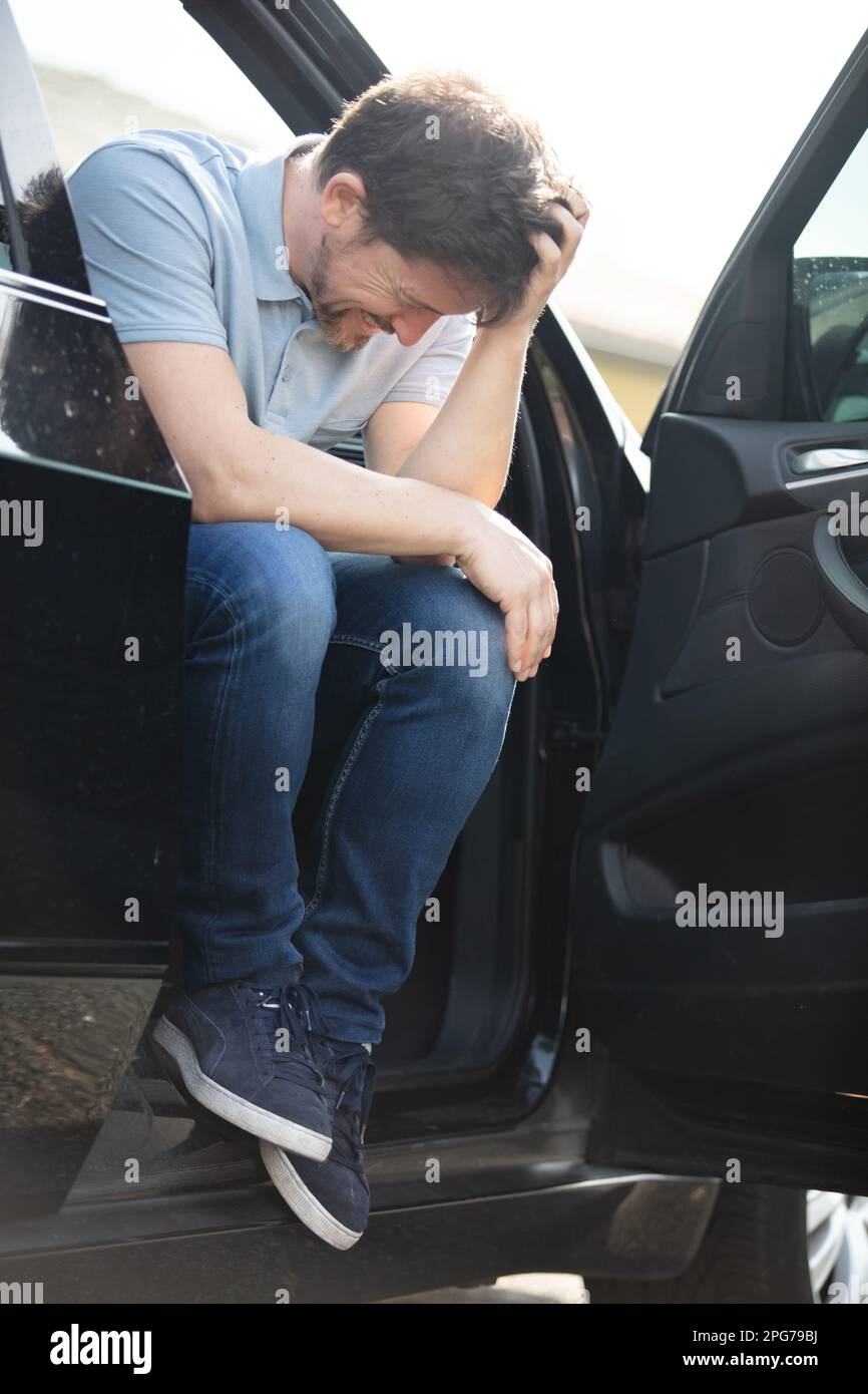 stressed young man driver sitting inside his car Stock Photo - Alamy