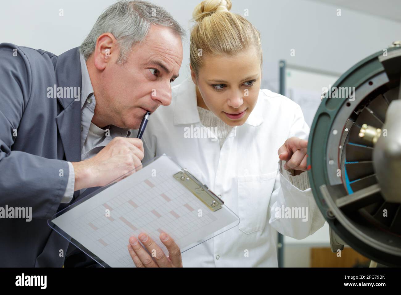 young aircraft mechanical engineer studying a design Stock Photo - Alamy