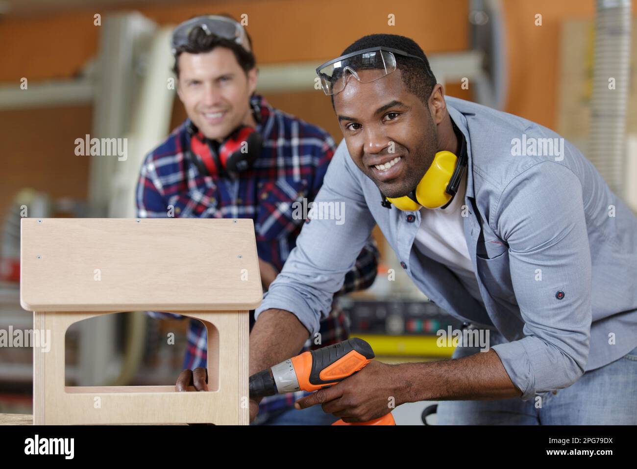two carpenters checking their design Stock Photo - Alamy