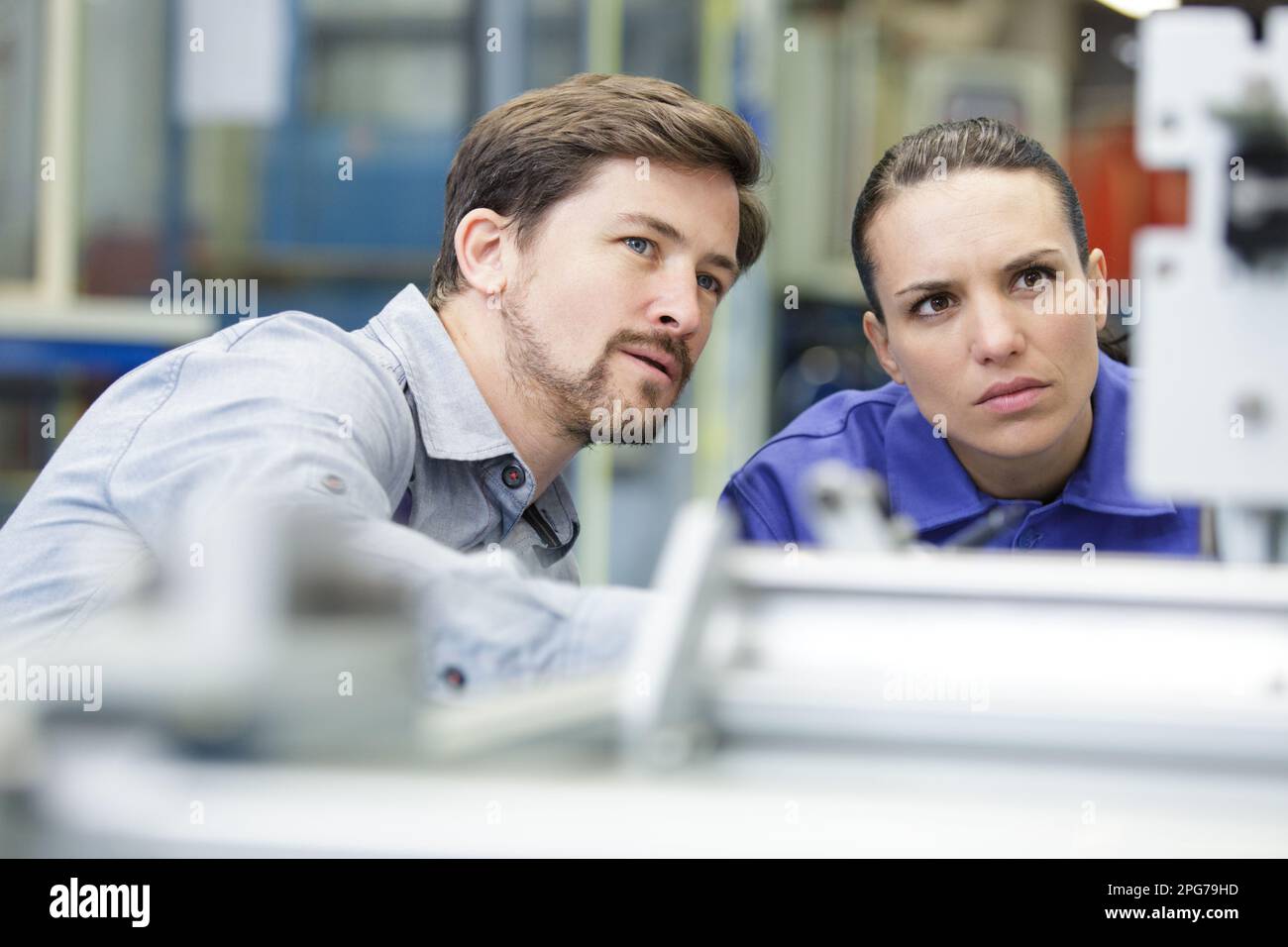 Smiling woman behind technician hi-res stock photography and images - Alamy