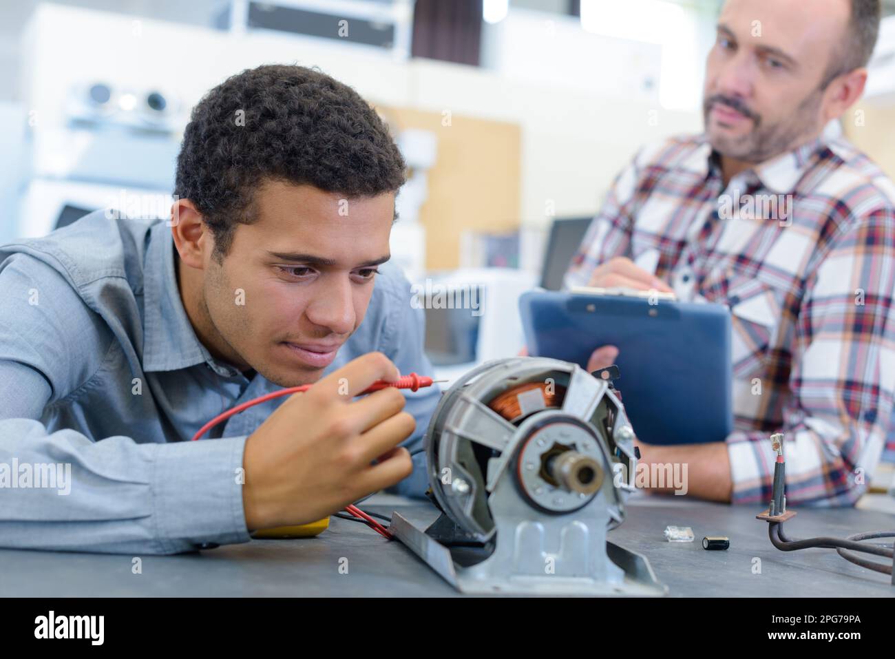technicians working with machine and cables Stock Photo - Alamy