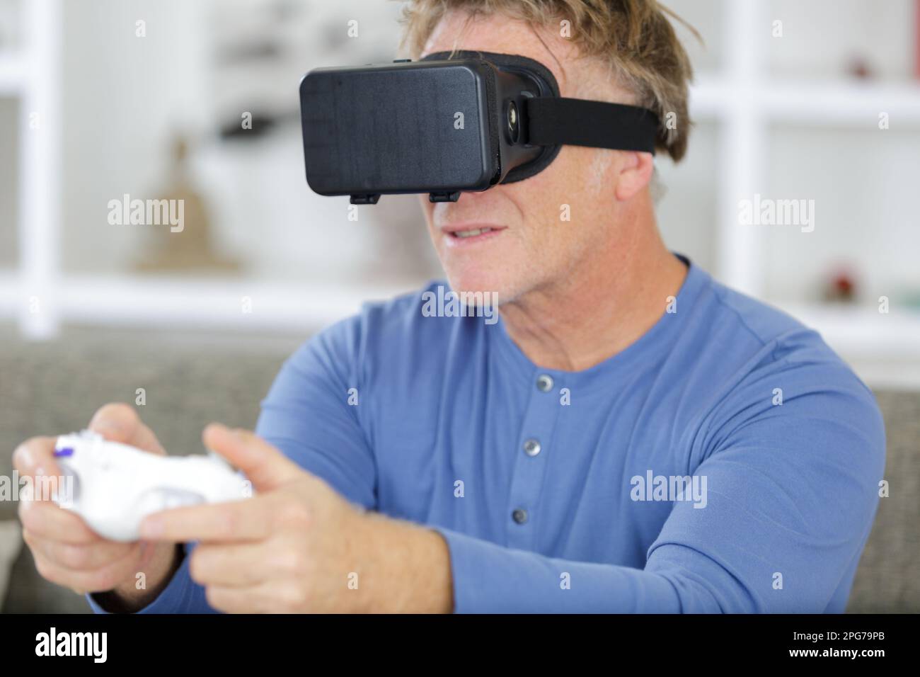 Mature male wearing vr headset hi-res stock photography and images - Alamy
