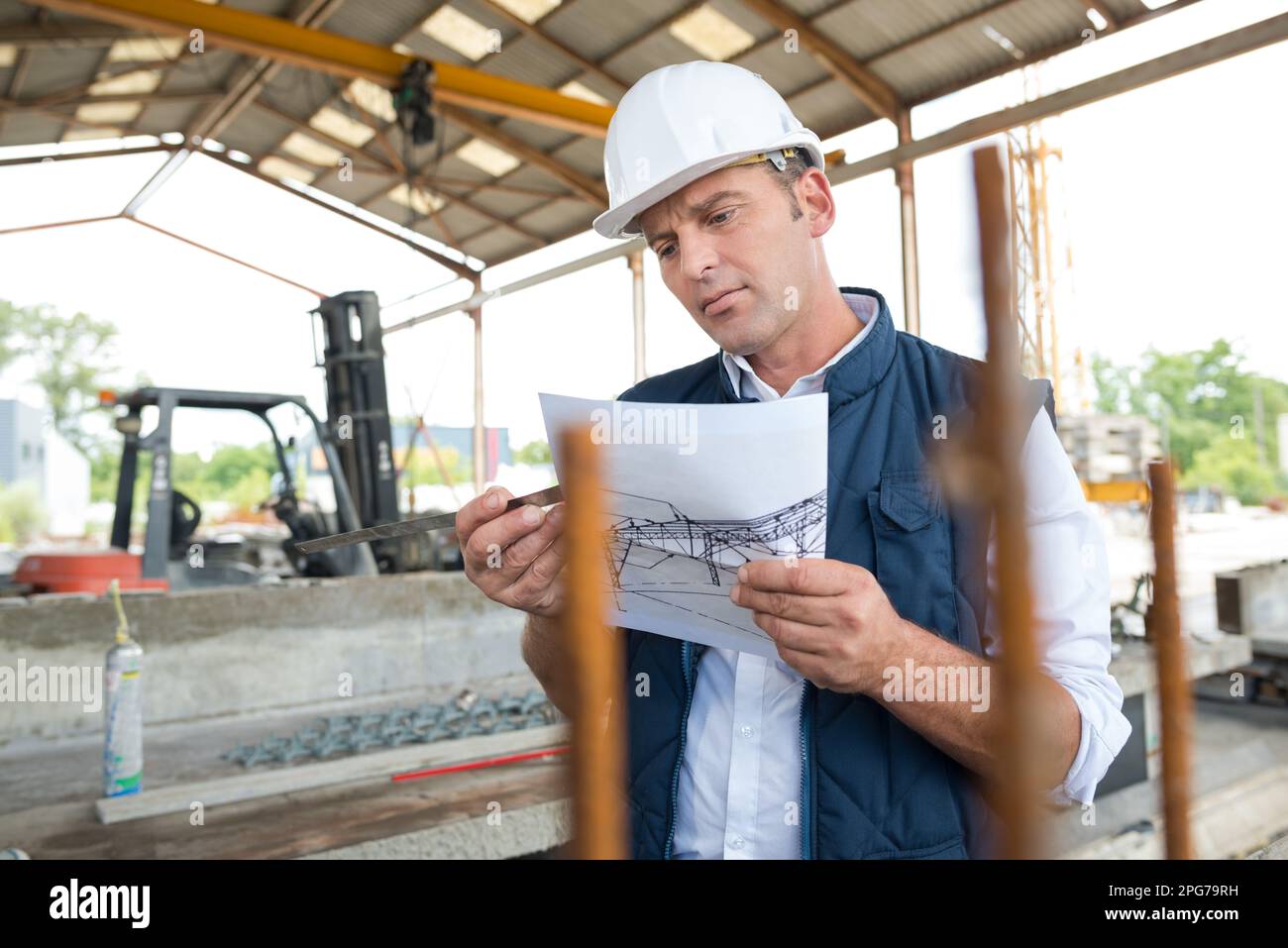 engineer man working with drawings inspection Stock Photo - Alamy