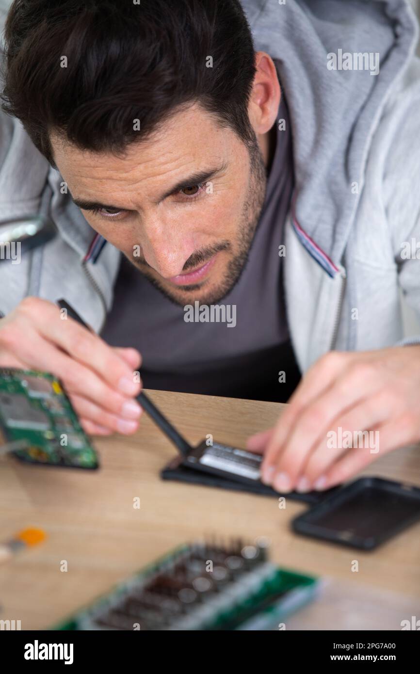 man during repair of wi-fi router Stock Photo - Alamy