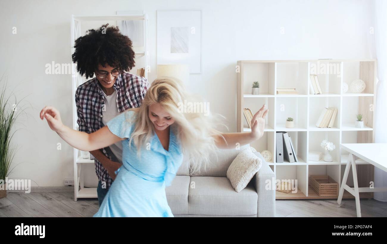 Morning fun home joy happy diverse couple dancing Stock Photo - Alamy
